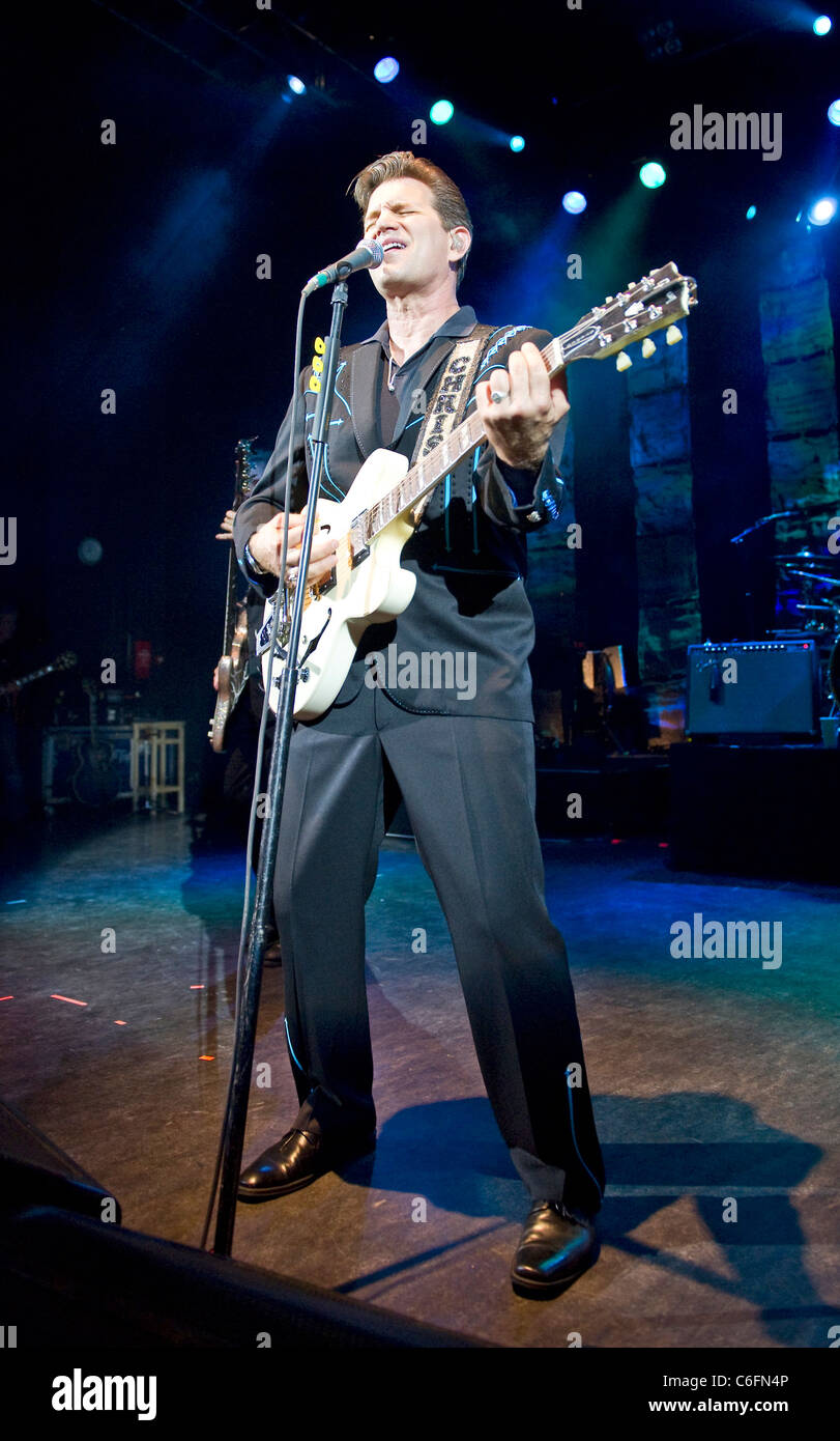 Singer Chris Isaak performing on stage during a concert Shepherds Bush ...