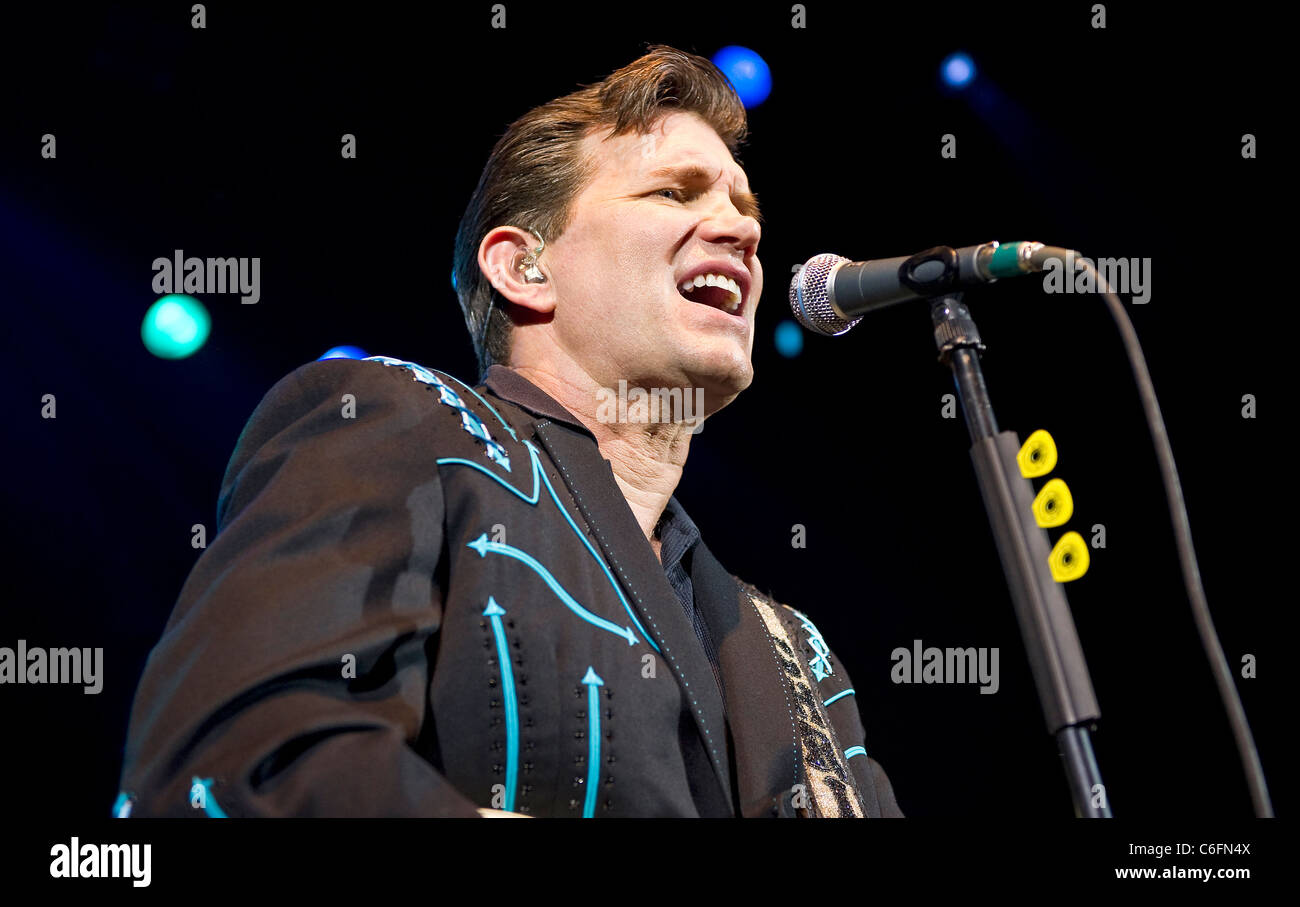 Singer Chris Isaak performing on stage during a concert Shepherds Bush ...