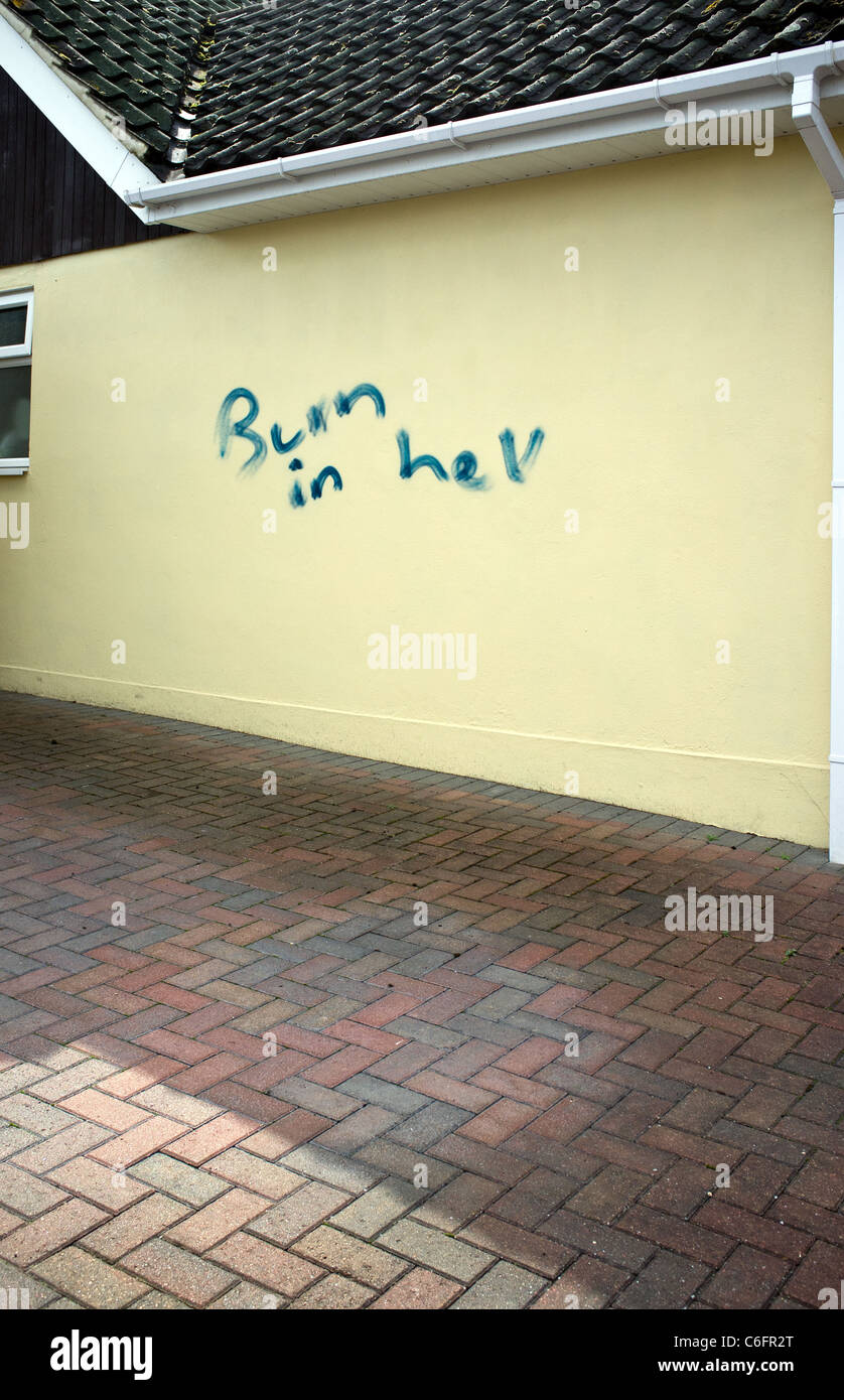 Graffiti sprayed on the wall of a house Stock Photo - Alamy