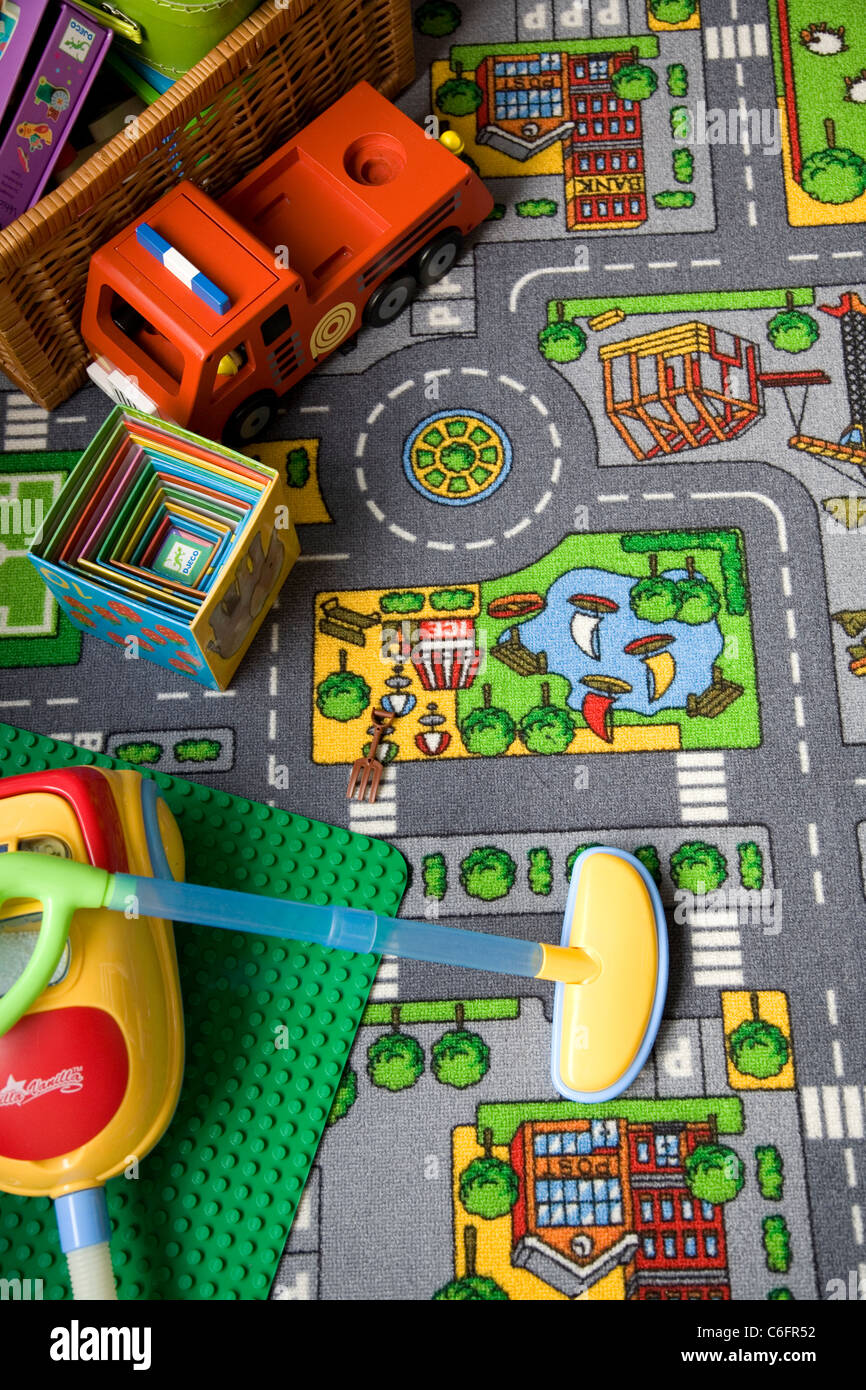 Childs Toy Carpet mat and toys Stock Photo - Alamy