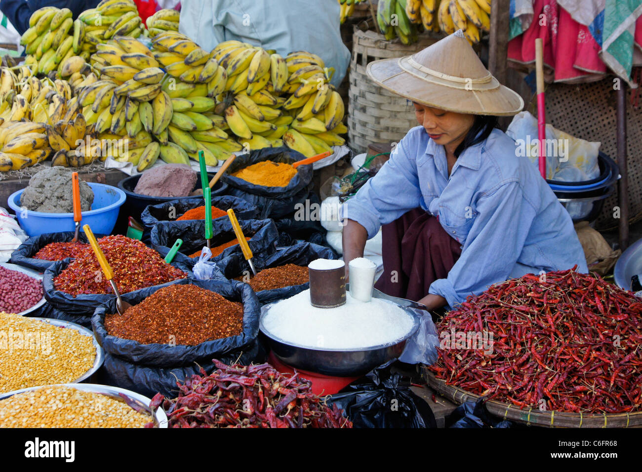 Woman selling spices and bananas in open-air market, Bago (Pegu ...