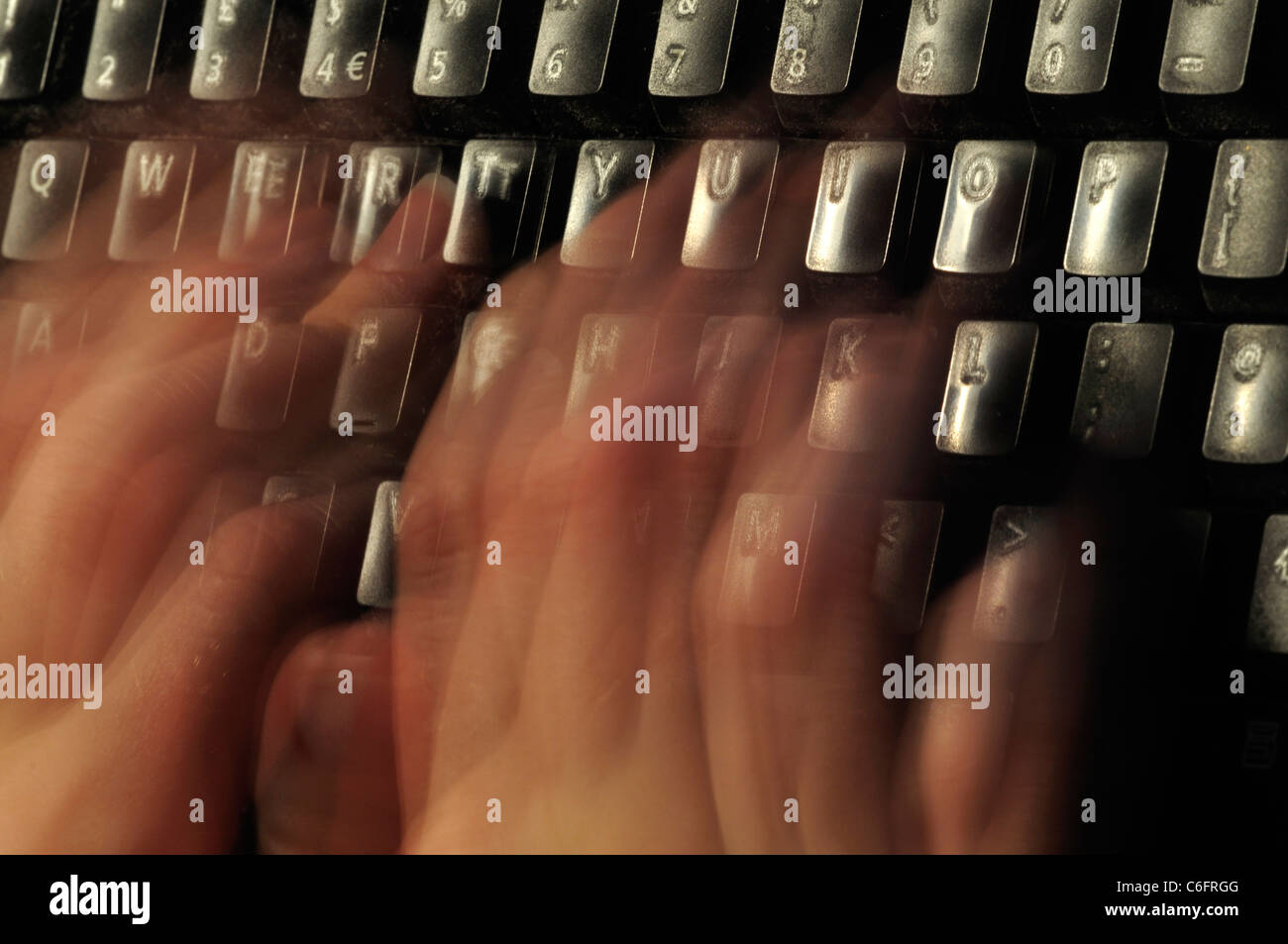 The fingerss of a typist at work on her keyboard UK Stock Photo - Alamy