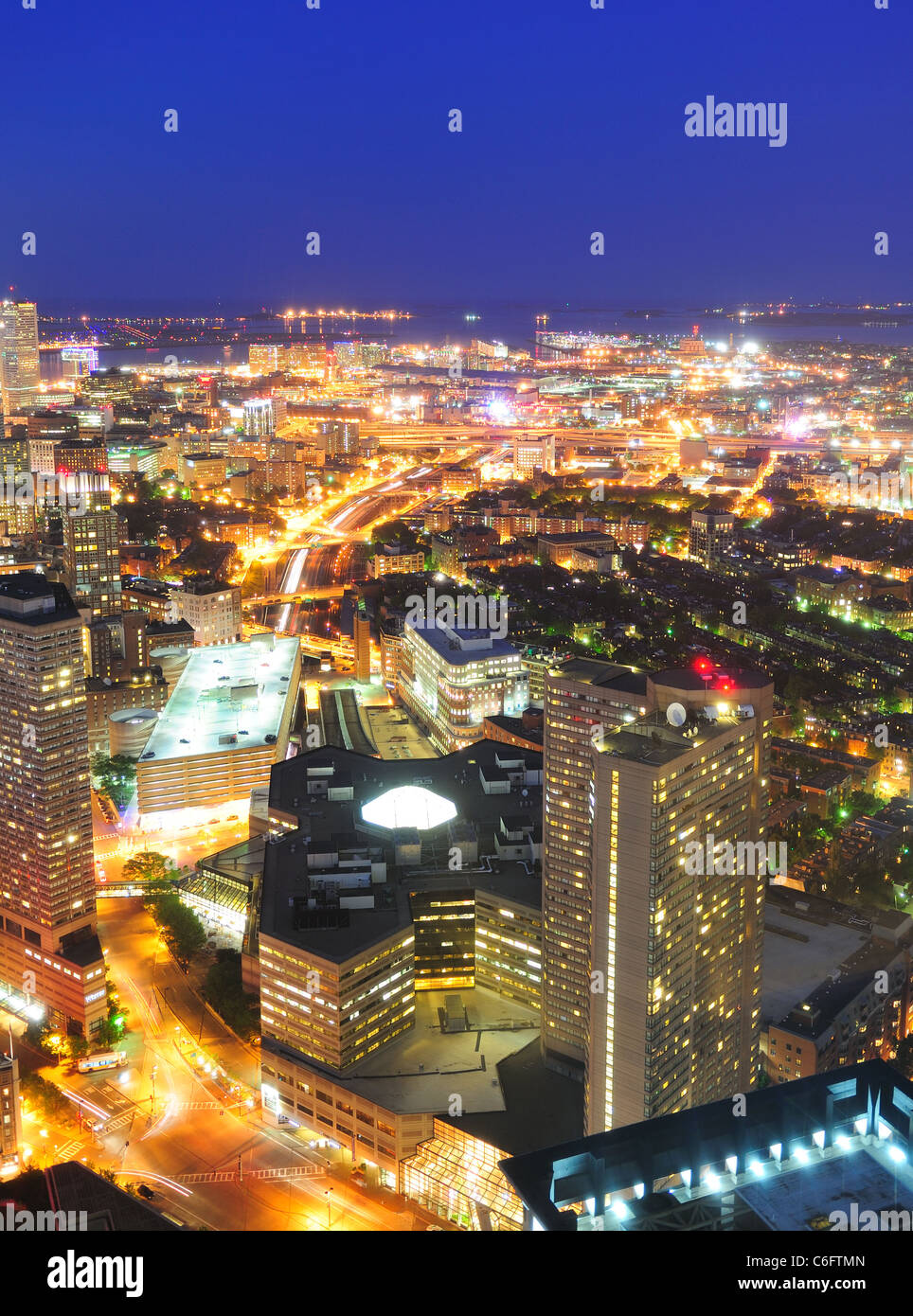 Urban city night scene. Boston aerial view with skyscrapers at night ...