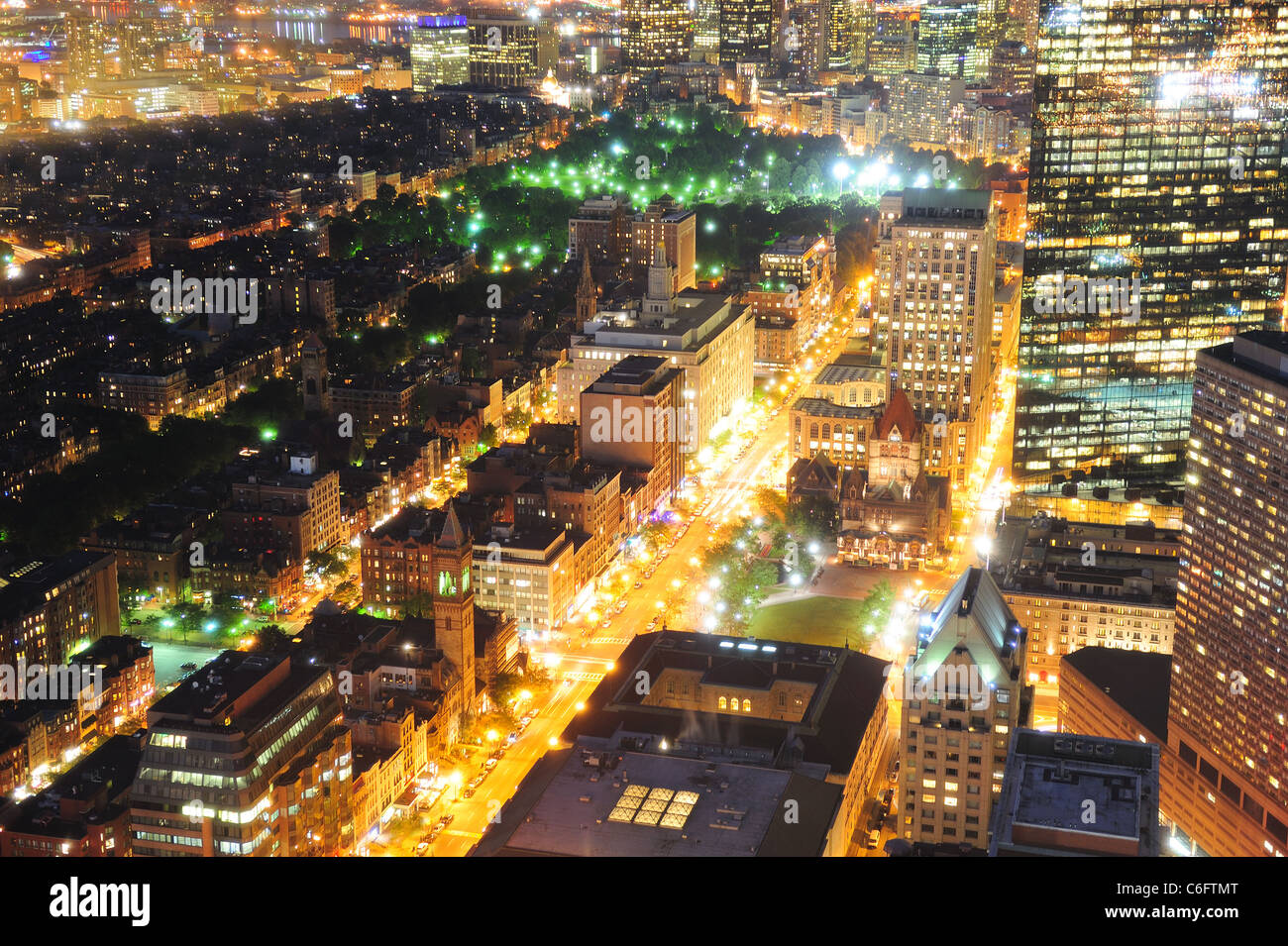 Urban city night scene. Boston aerial view with skyscrapers at night ...