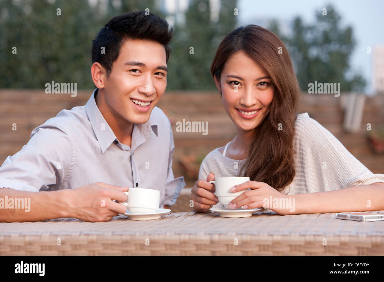 Friends Relaxing at a Cafe Stock Photo - Alamy
