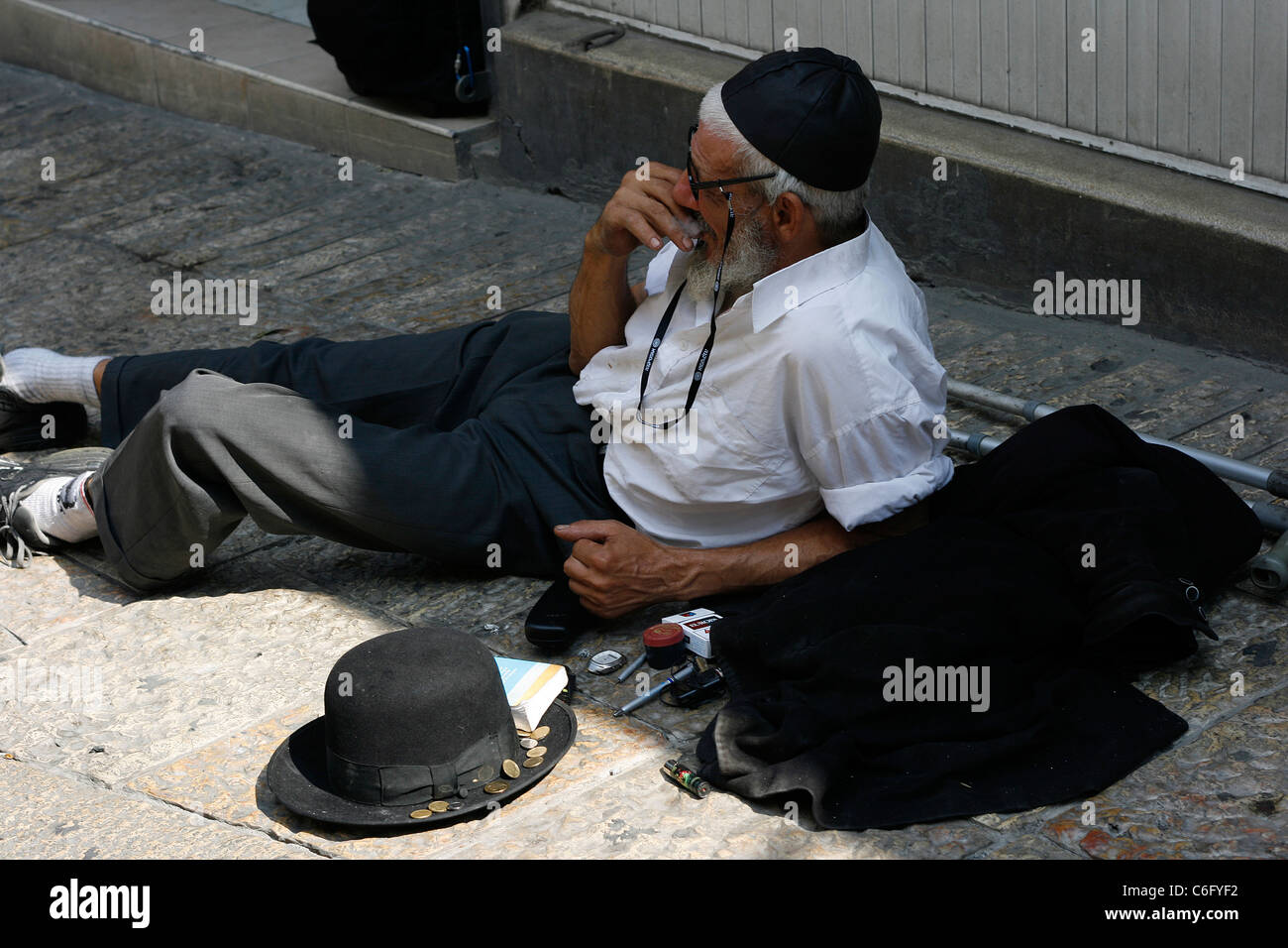 A homeless Jewish Orthodox being laid up on the street in the Jewish ...