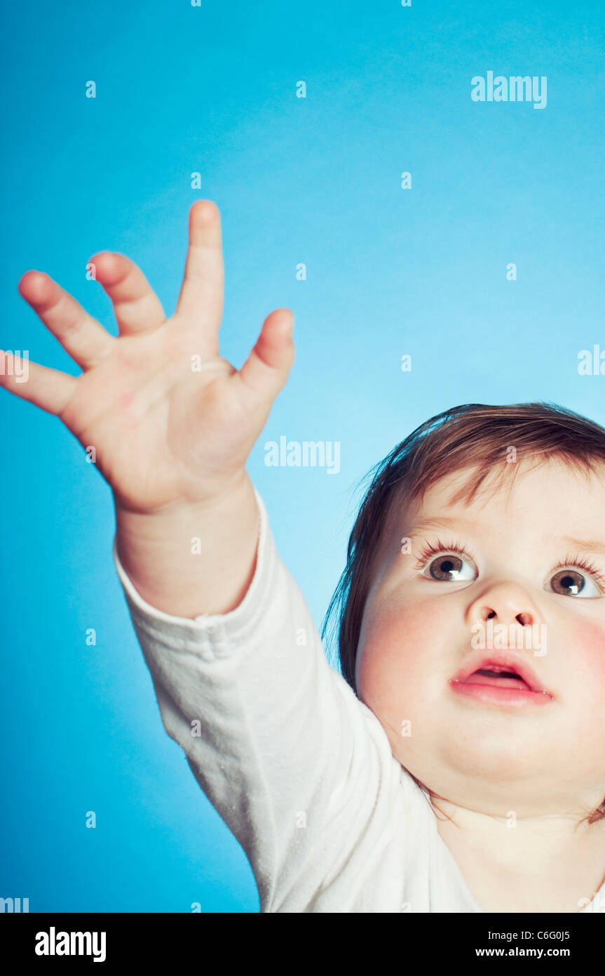 A baby girl with arm outstretched, pointing Stock Photo - Alamy