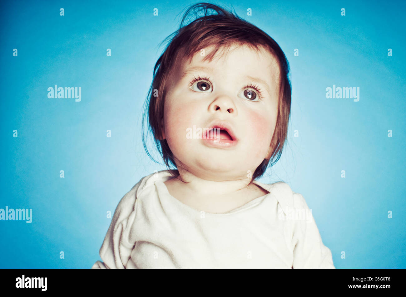 A portrait of a baby girl, looking up Stock Photo - Alamy