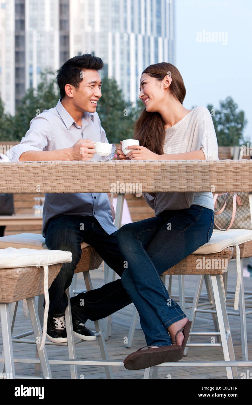 Couple Relaxing at a Cafe Stock Photo - Alamy
