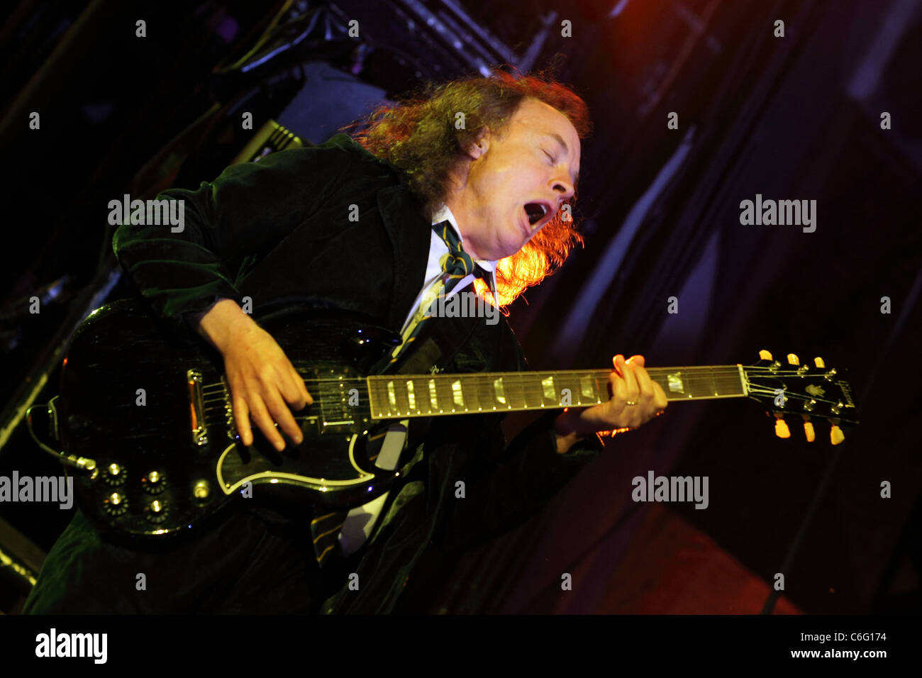 Angus Young of ACDC performing live in concert as part of the "Black ...