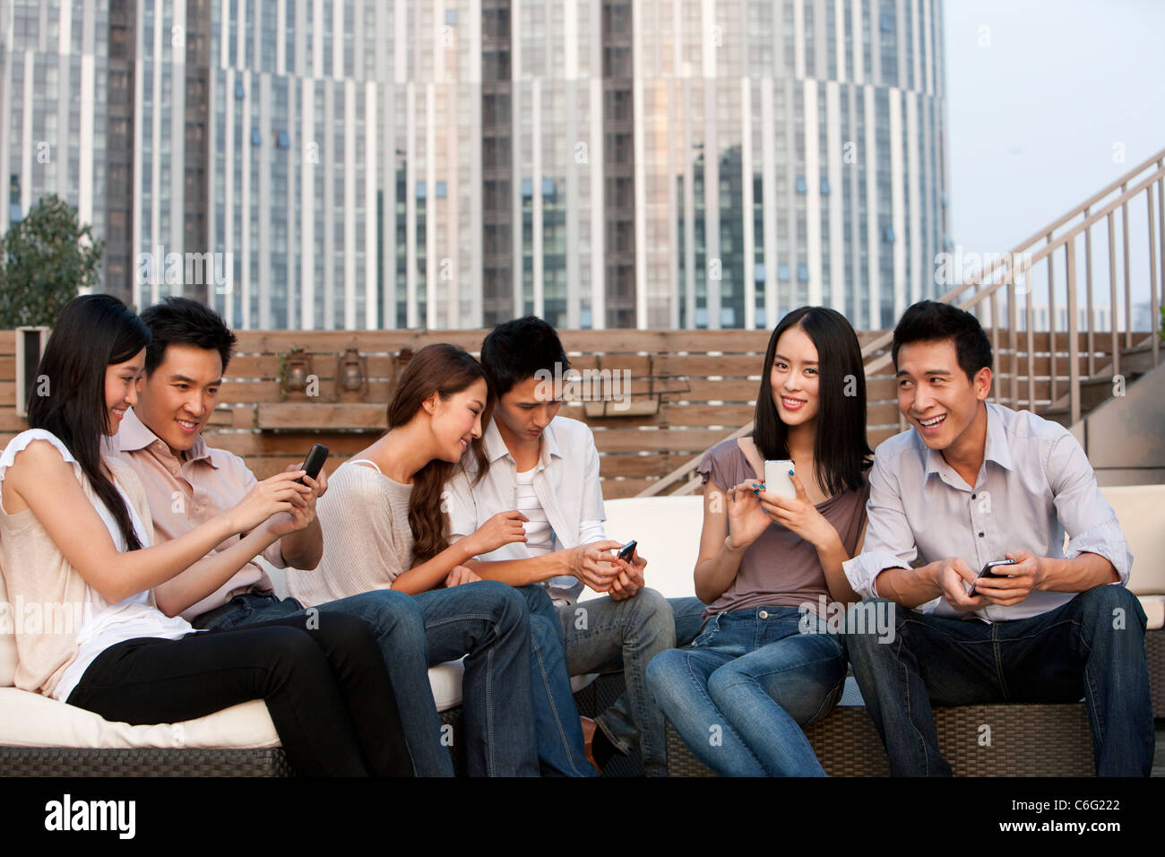 Friends Relaxing at an Outdoor Bar Stock Photo - Alamy