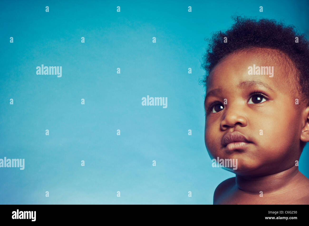 A portrait of a baby girl, looking thoughtful Stock Photo - Alamy