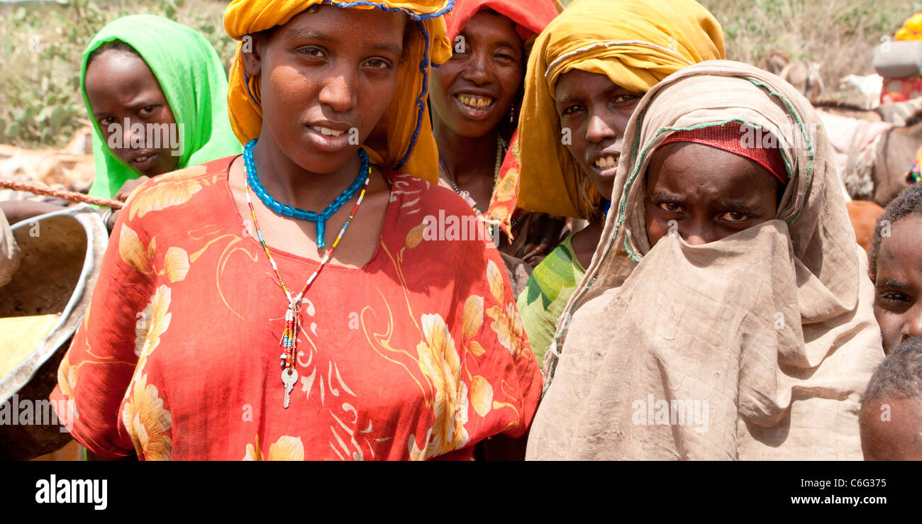 Traditional Oromo tribespeople at a watering-hole in the Chercher ...