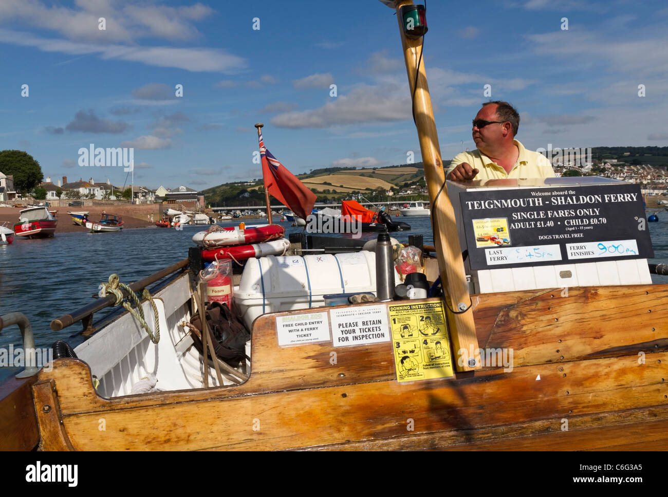 The Shaldon to Teignmouth ferry captain steering across the estuary ...