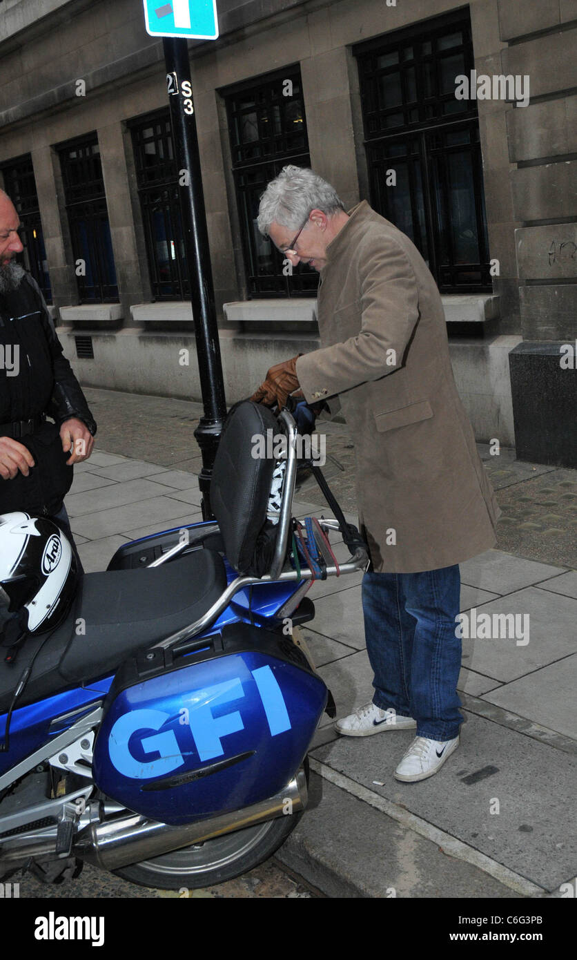 Paul O'Grady takes a 'Virgin Limobike' a London motorcycle taxi. London ...