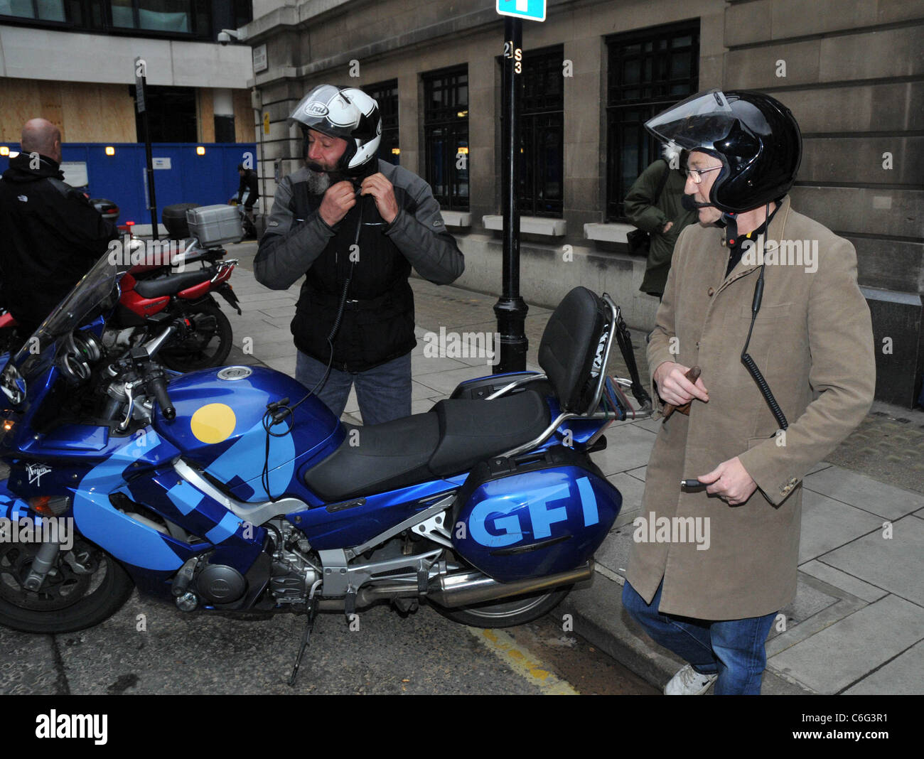 Paul O'Grady takes a 'Virgin Limobike' a London motorcycle taxi. London ...