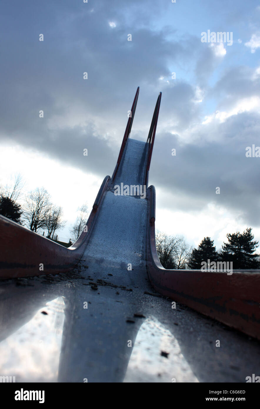 A slide in a playground after the rain has fallen Stock Photo - Alamy