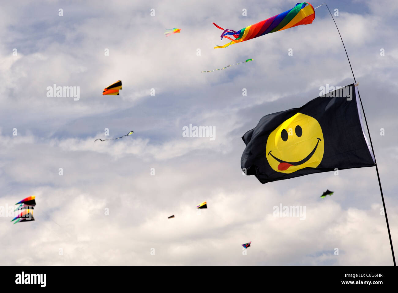 kites and smiley flag flying at southsea kite festival Stock Photo - Alamy