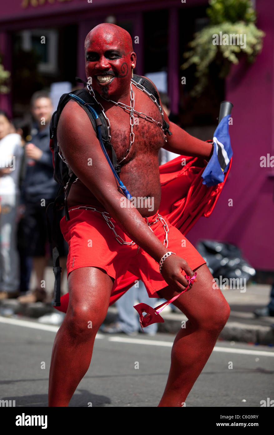 Male dancer in a red costume, Notting Hill Carnival 2011, London ...