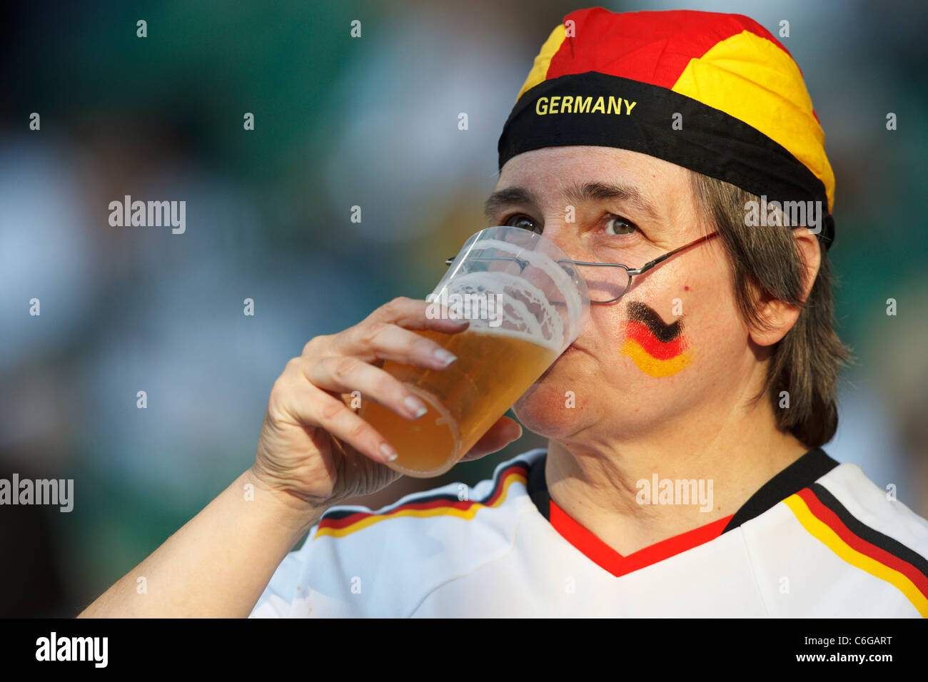 A spectator enjoys a beer hi-res stock photography and images - Alamy