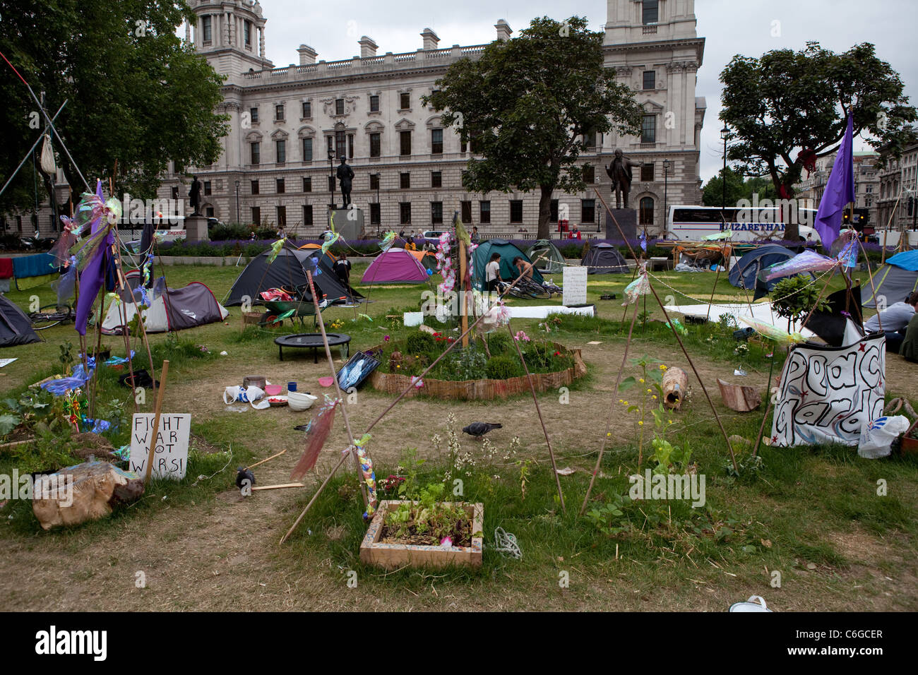 Plant pots, flags and a baby oak tree make up the peace garden at ...