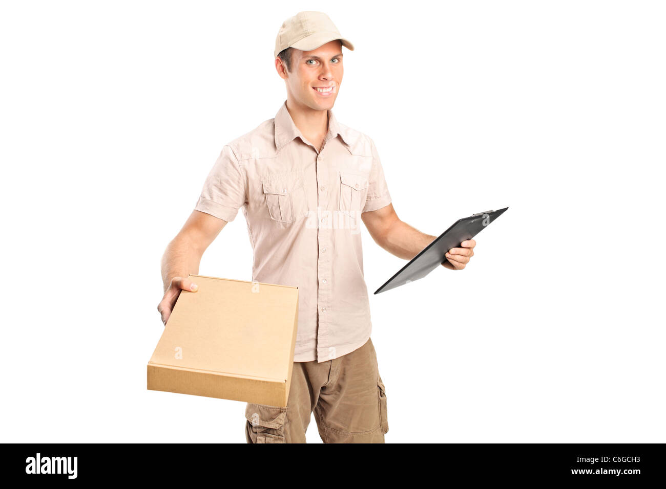 Delivery boy delivering a packet and holding a clipboard Stock Photo ...
