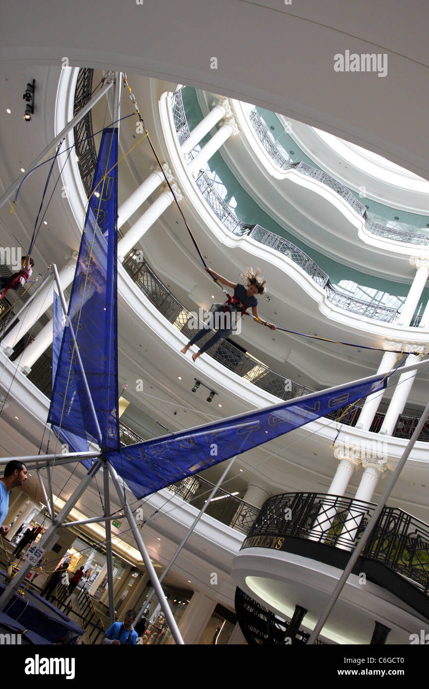 Bungee jumping inside Whiteley's of Queensway in London Stock Photo - Alamy