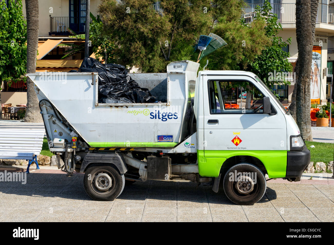 Refuse collection vehicle on the promenade in Sitges near Barcelona ...