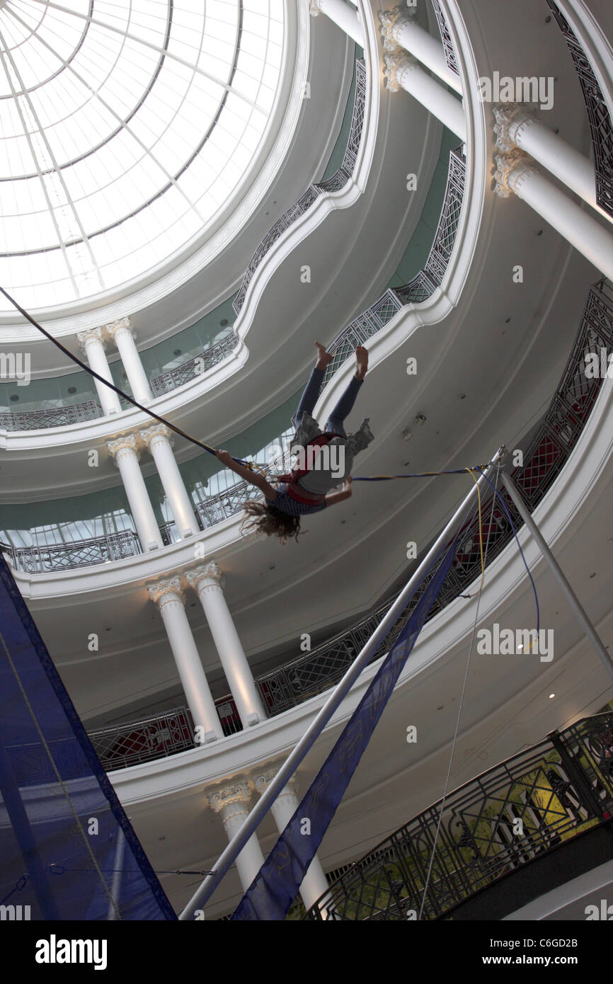 Bungee jumping inside Whiteley's of Queensway in London Stock Photo - Alamy