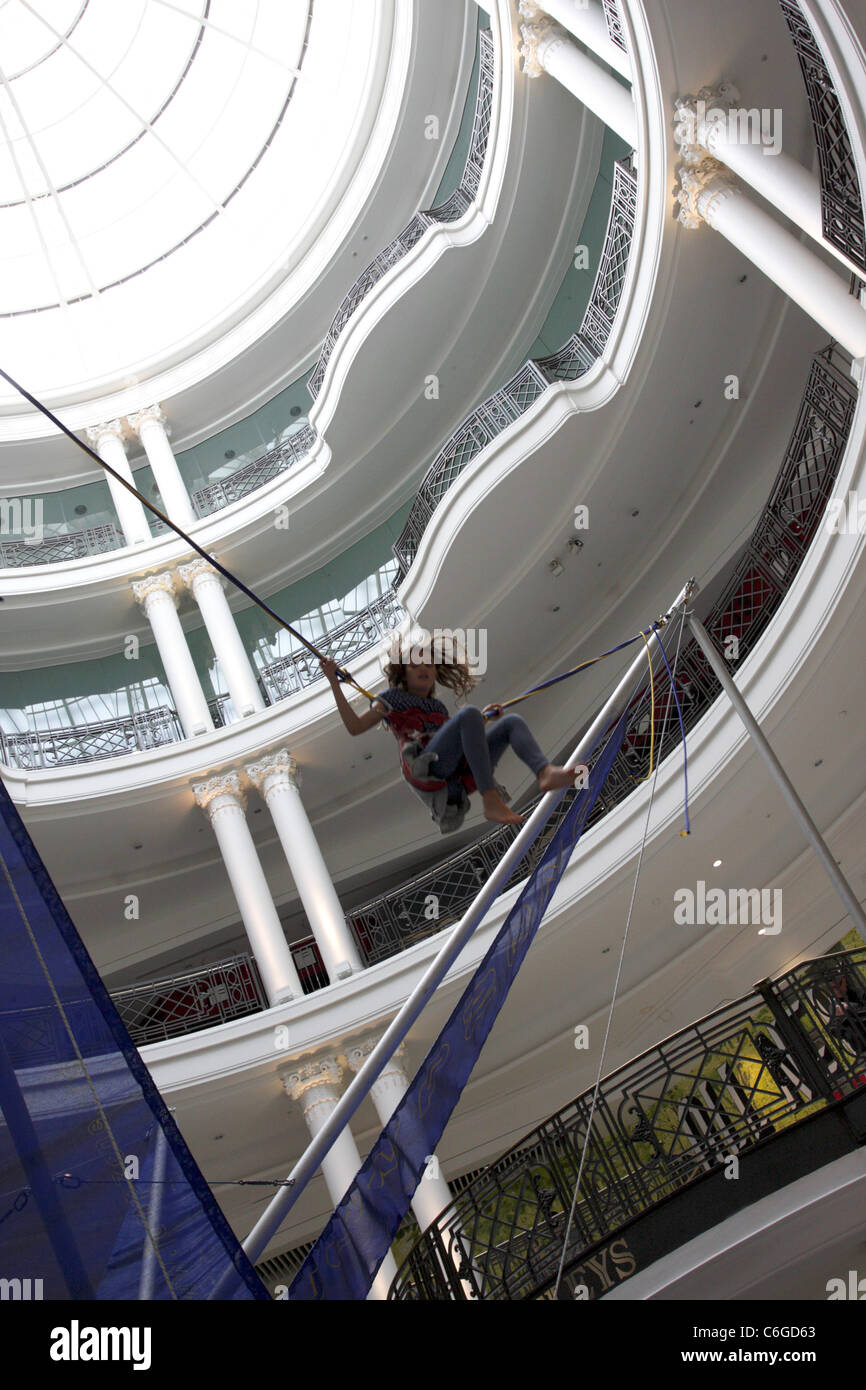 Bungee jumping inside Whiteley's of Queensway in London Stock Photo - Alamy