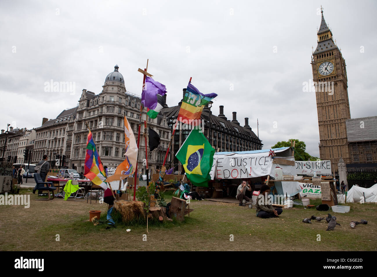 Colourful flags and banners at Democracy Village peace camp with Big ...