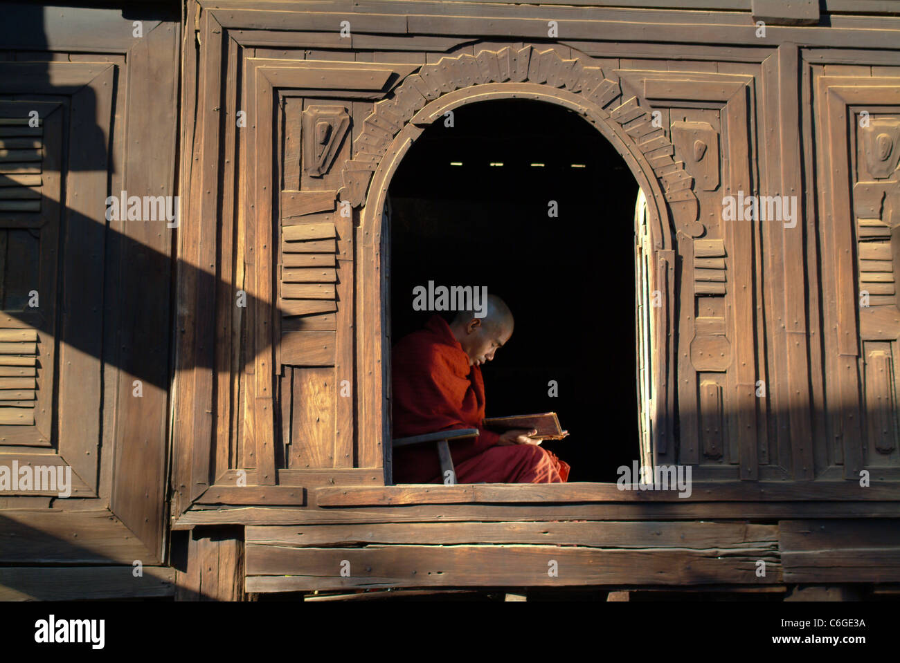 A Monk Reading Buddhist Scriptures in an Old Teak Built Monks Dwellings ...