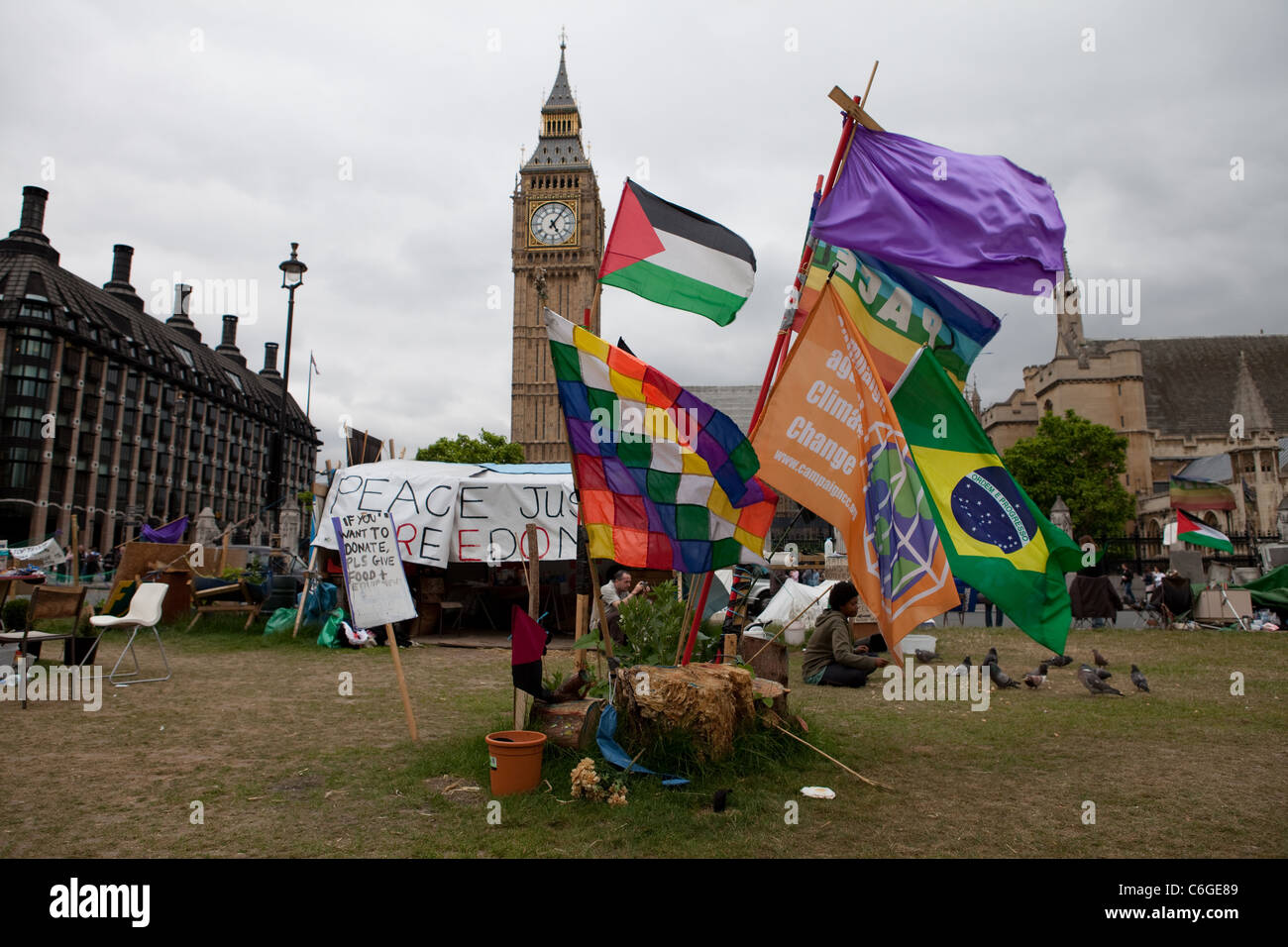 Colourful flags and banners at Democracy Village peace camp with Big ...