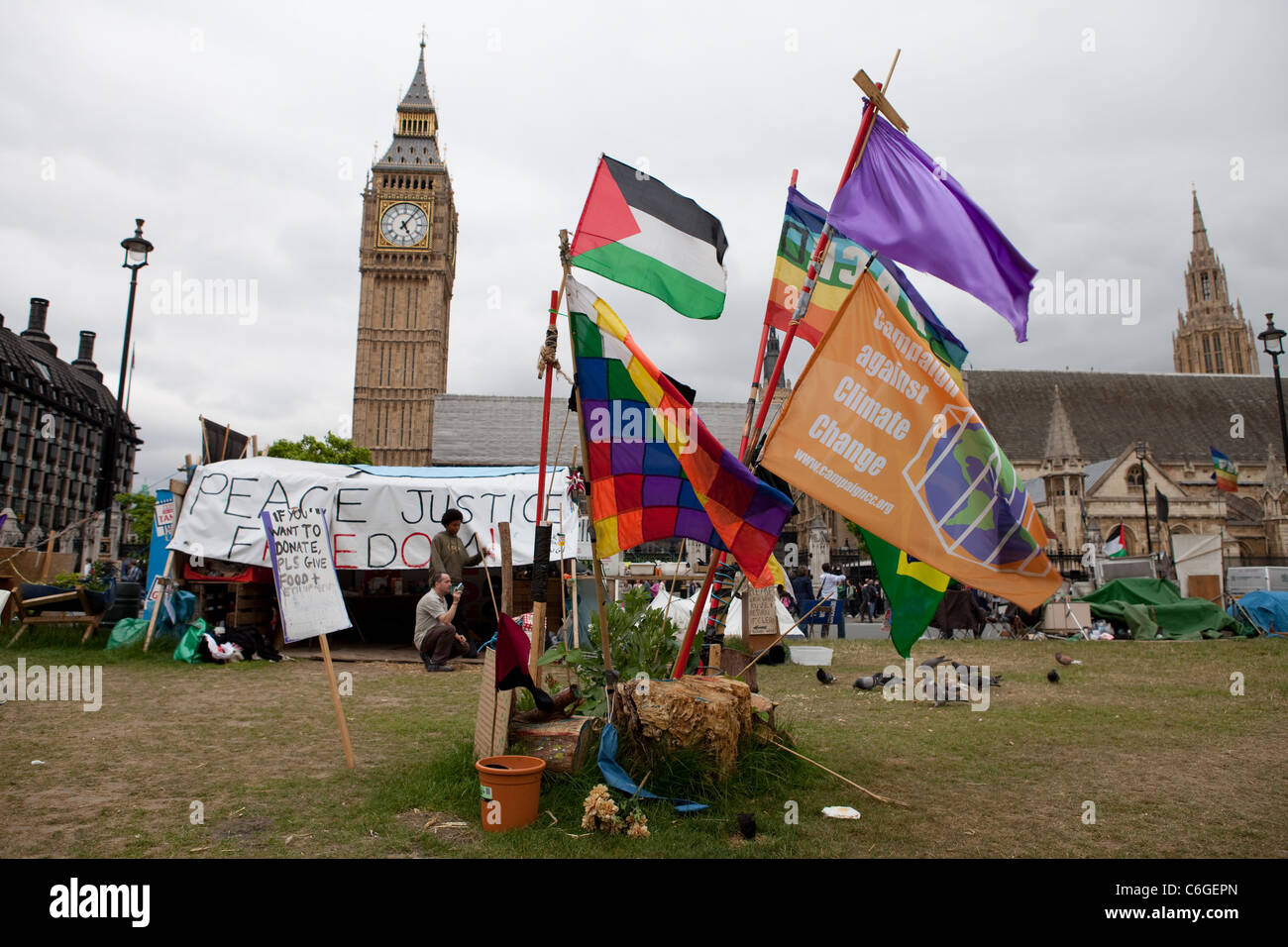 Colourful flags and banners at Democracy Village peace camp with Big ...