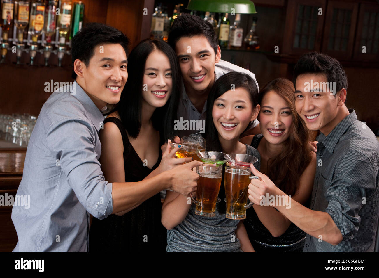 Friends Relaxing at a Bar Stock Photo - Alamy