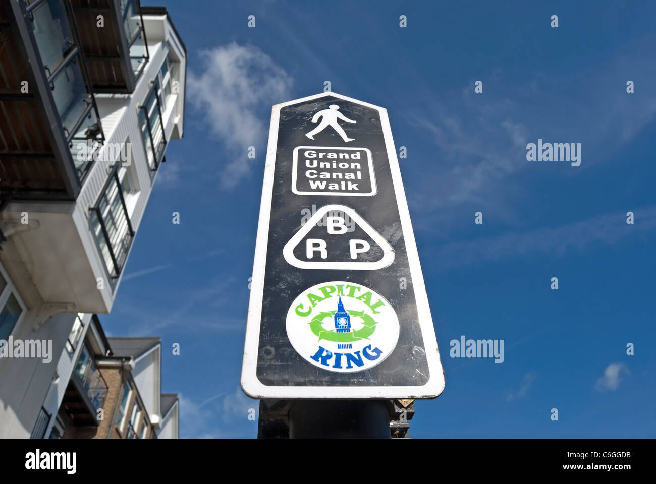 signpost showing walking routes for the grand union canal, brp, and ...
