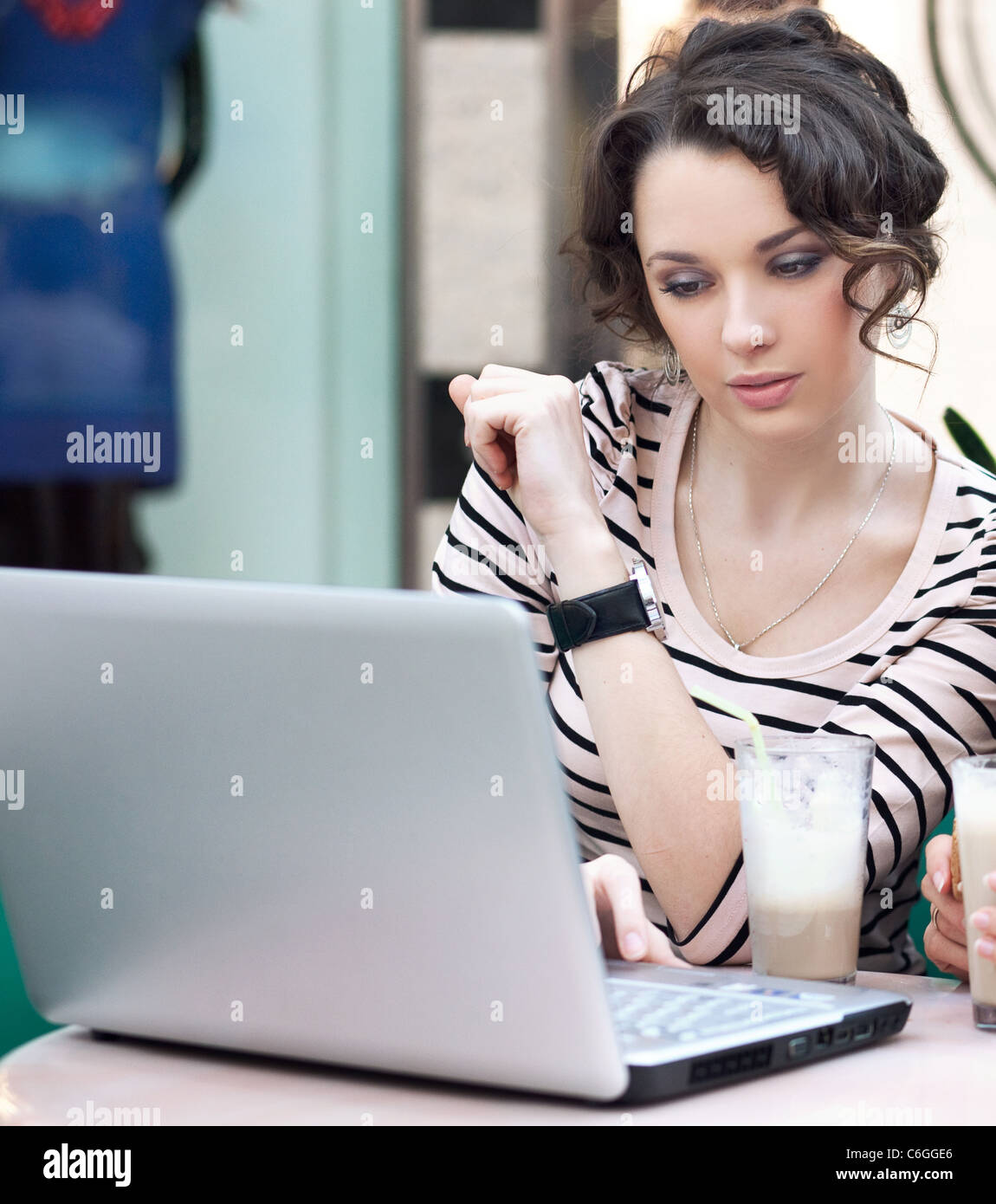 Young beautiful girl working on laptop Stock Photo - Alamy