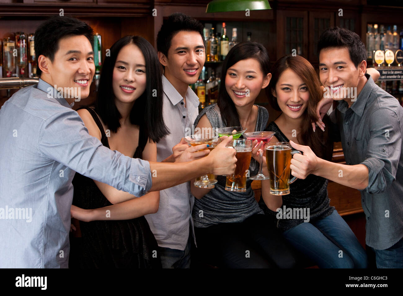 Friends Relaxing at a Bar Stock Photo - Alamy