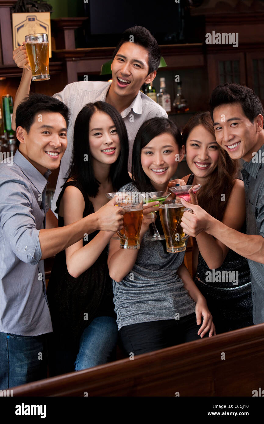 Friends Relaxing at a Bar Stock Photo - Alamy