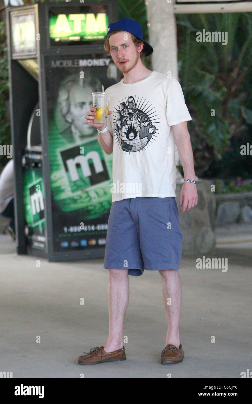 American rapper Asher Roth cools down with a cold beverage at the 2010 ...