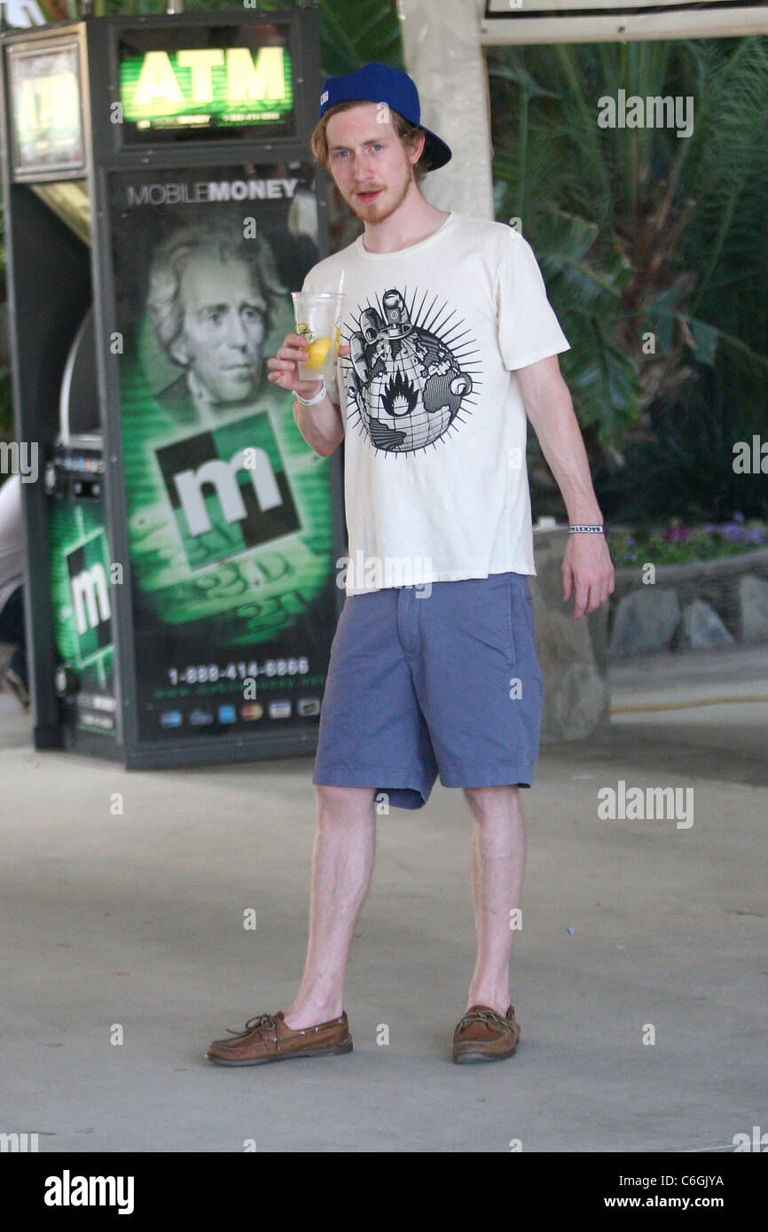 American rapper Asher Roth cools down with a cold beverage at the 2010 ...
