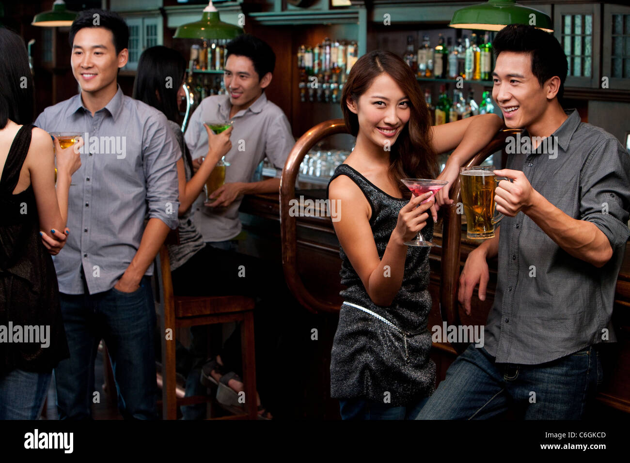 Friends Relaxing at a Bar Stock Photo - Alamy