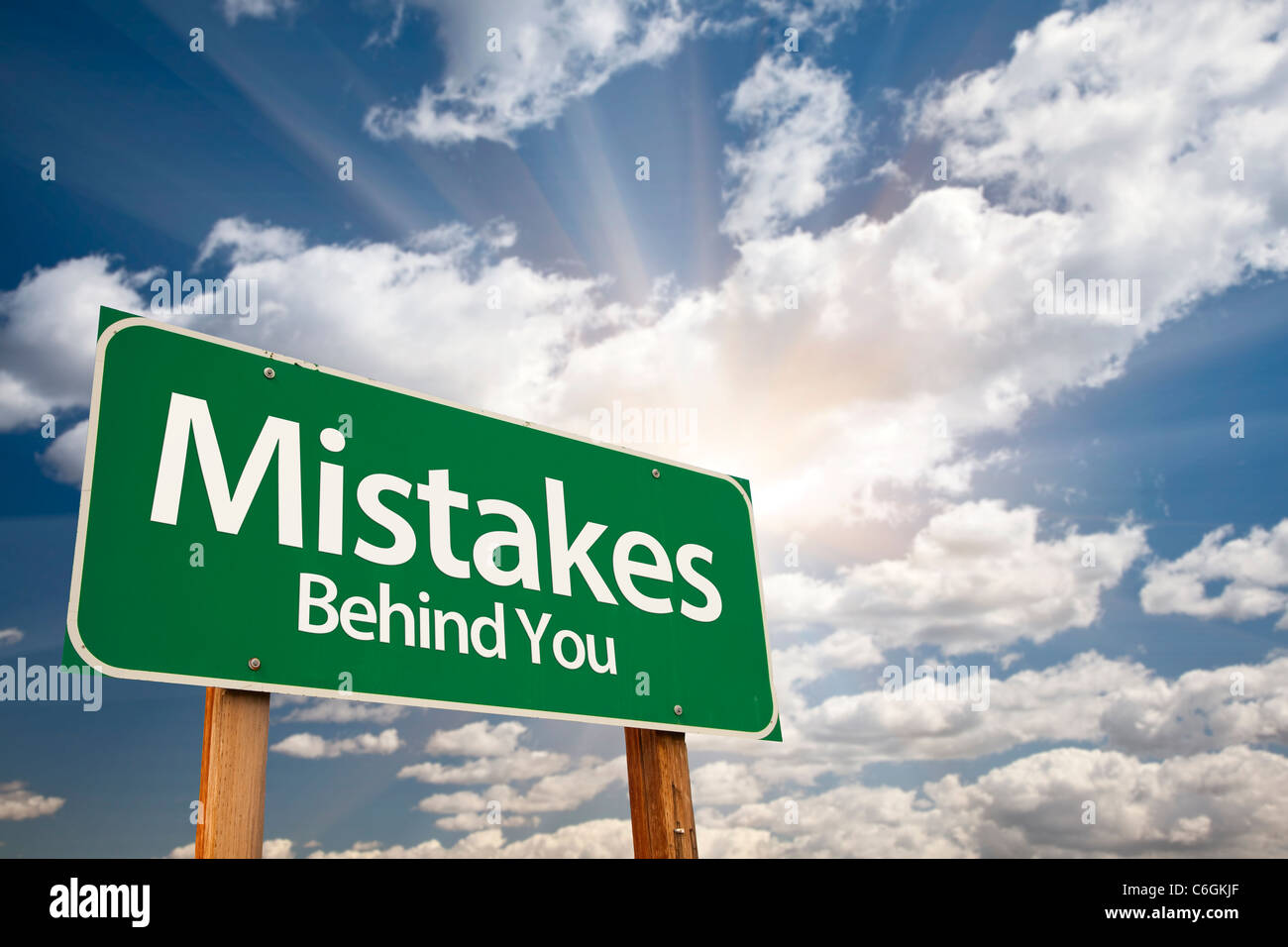 Mistakes, Behind You Green Road Sign Against Dramatic Sky, Clouds and ...