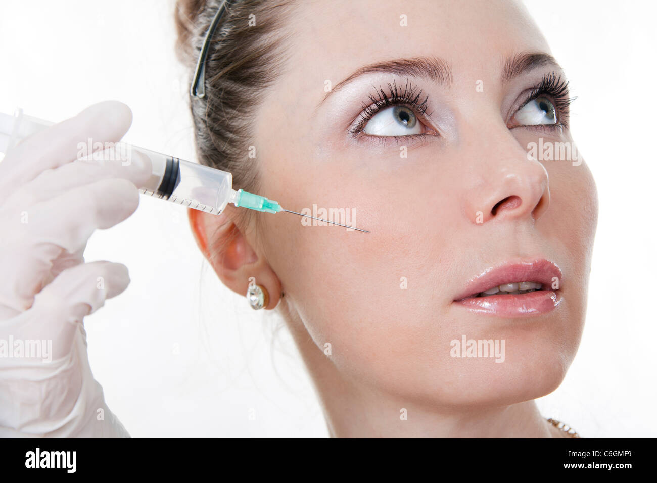 Cosmetic treatment with botox injection. White isolated Stock Photo - Alamy
