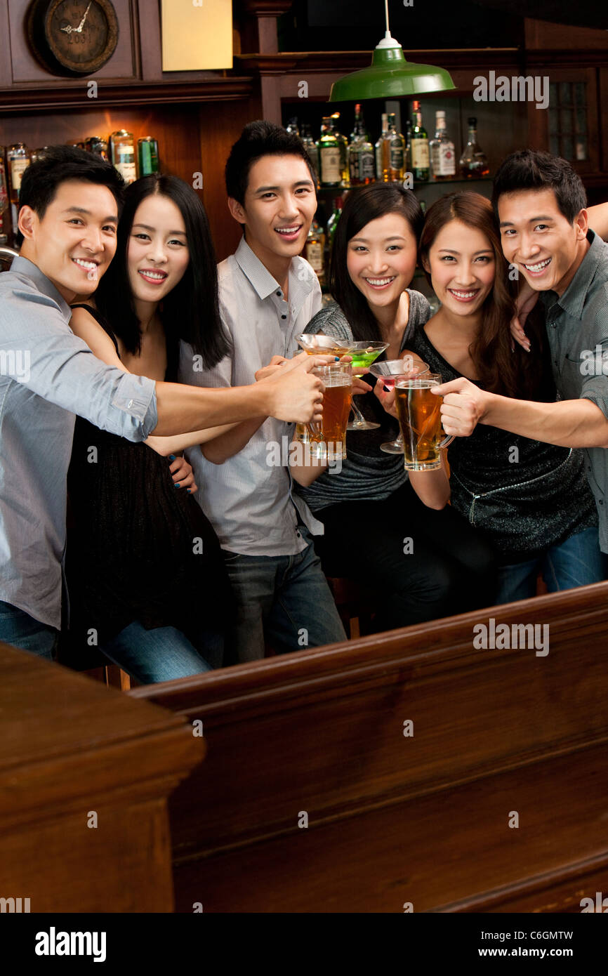 Friends Relaxing at a Bar Stock Photo - Alamy