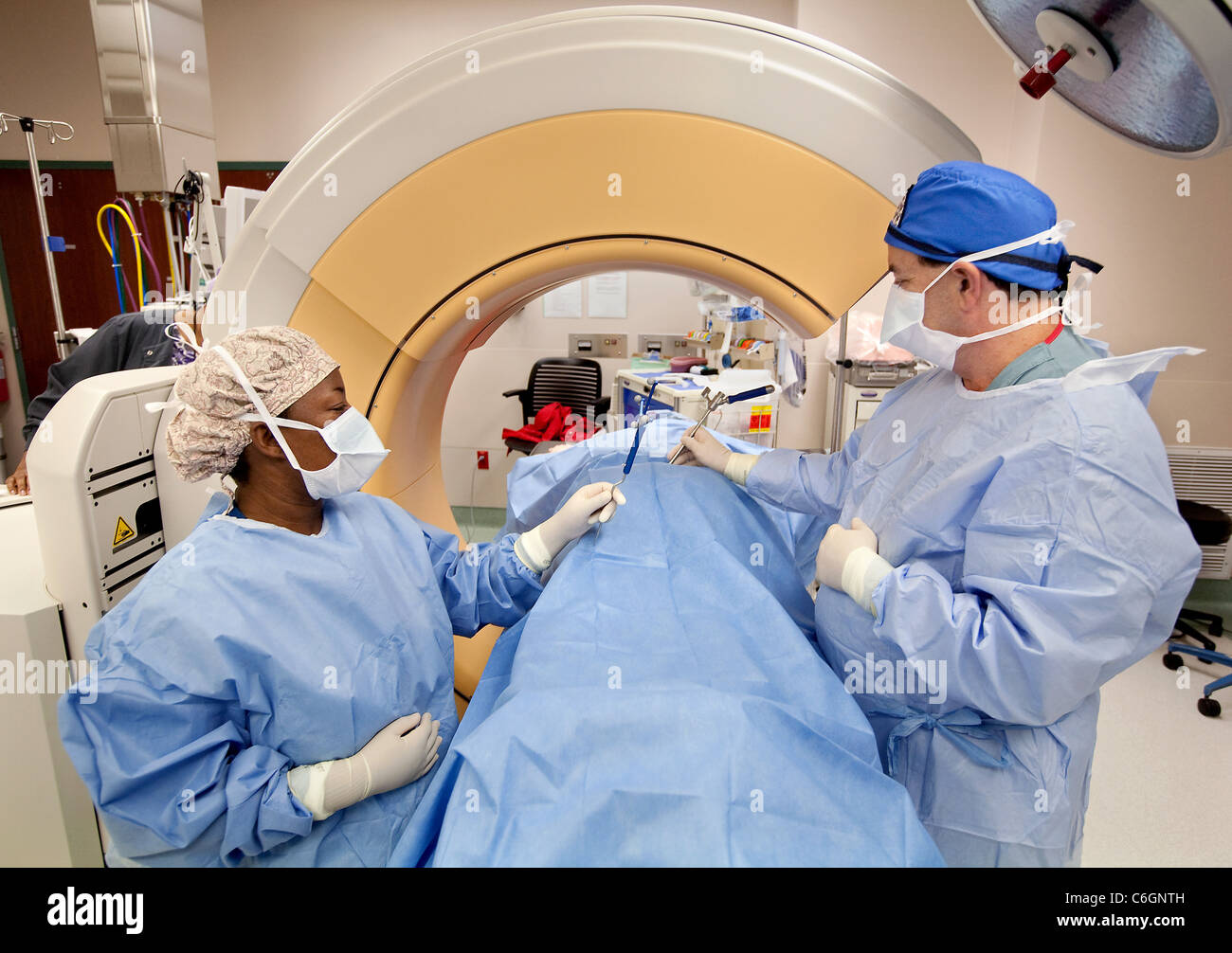 A doctor and nurse prepare a patient for surgery Stock Photo - Alamy
