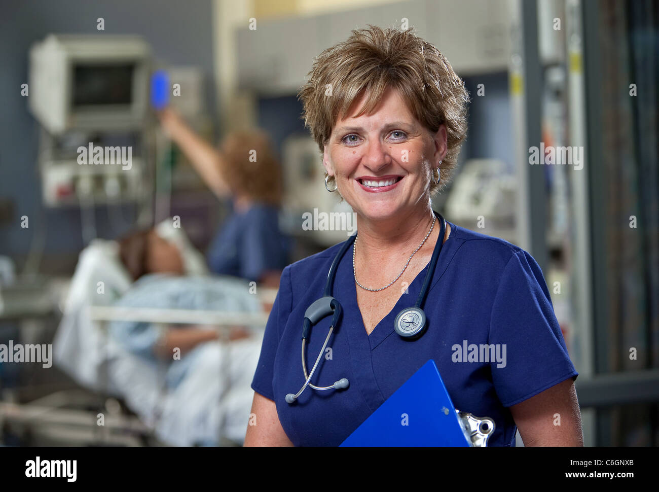 A nurse poses outside of a hospital room Stock Photo - Alamy