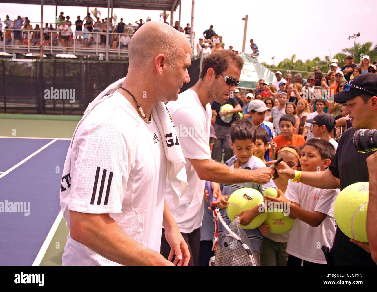 Retired US tennis champions Andre Agassi and Pete Sampras open a free ...