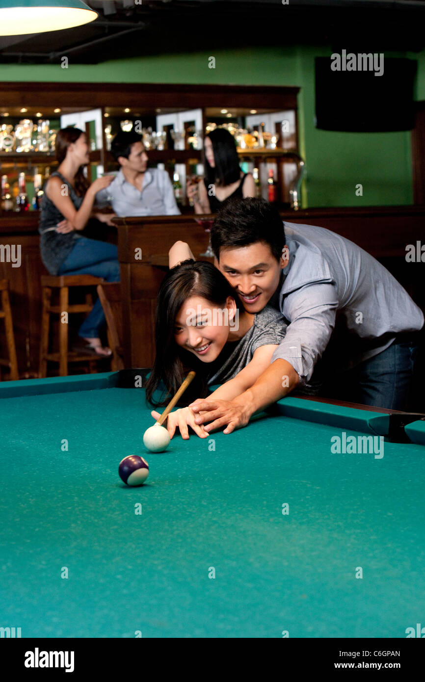 Asian couple playing pool hi-res stock photography and images - Alamy