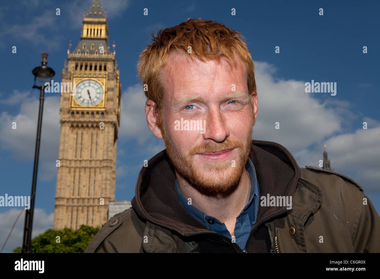 Portrait of Democracy Village camper Gareth Newman with Big Ben in the ...